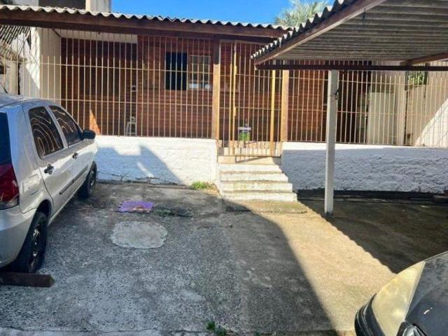 Terreno de 392m² com casa mista de 82m²