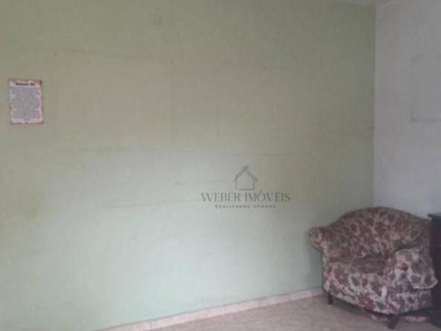 Terreno de 312 m² com 2 Casas e Salão – Excelente Potencial Comercial e de Investimento