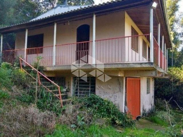 Terreno de 3.032,00m2 no Bairro Cascata em Porto Alegre, com 2 casas de alvenaria