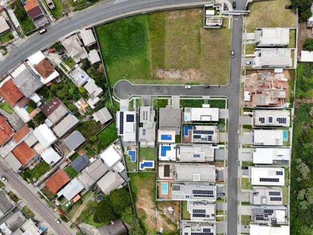 Terreno em condominio divisa com Atuba