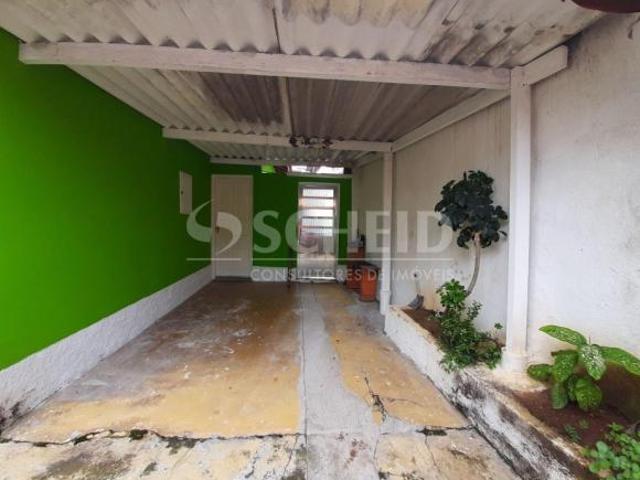 Terreno em Local Comercial com Casa Térrea