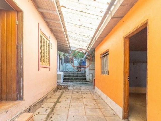 Terreno grande com casas no Morro Santana, ao lado do Atacado Cestto