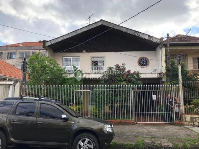 Terreno 10x35 com casa no Bairro Cristo Redentor