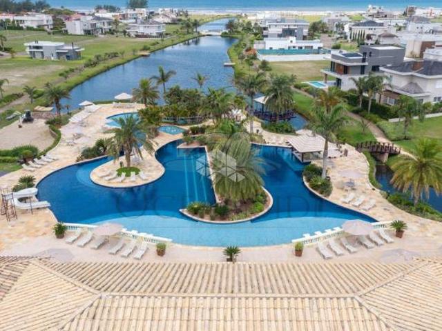 Terreno 600m² privativos, beira mar, em condomínio fechado em Torres