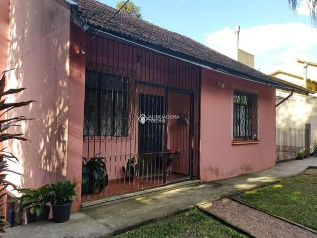 Casa 3 dormitórios, gabinete, lavanderia, lareira,sacada, sala de estar e jantar e terrenão