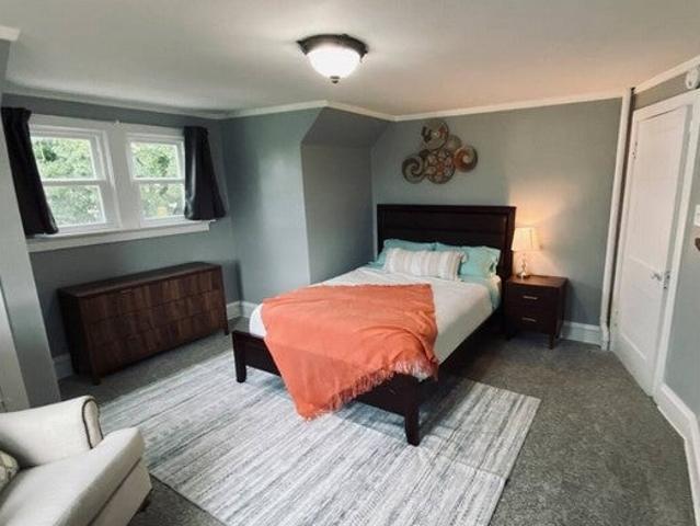 The bedroom offers a peaceful retreat with ample