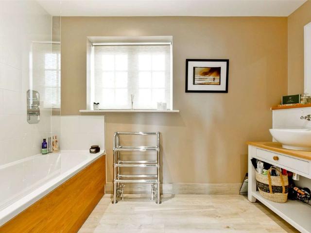 The Stone House is a beautifully presented detached family home located in Peppard Common