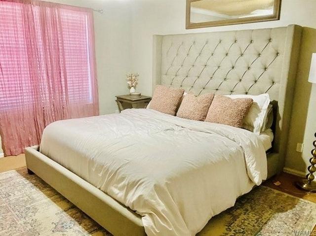 The room includes a new and comfortable queen