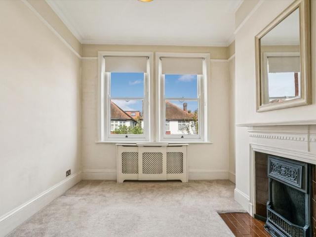 This charming three bedroom apartment is perfectly situated on a sought after road in the heart of Wimbledon