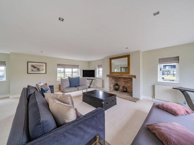 This detached home is set behind electric gates and dates back to around 1840