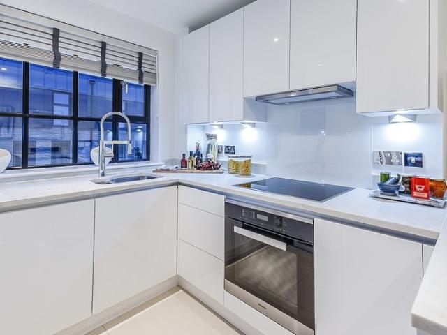This exceptional two bedroom, two bathroom second floor apartment with private terrace and river views is set within this newly converted, warehouse style, gated development