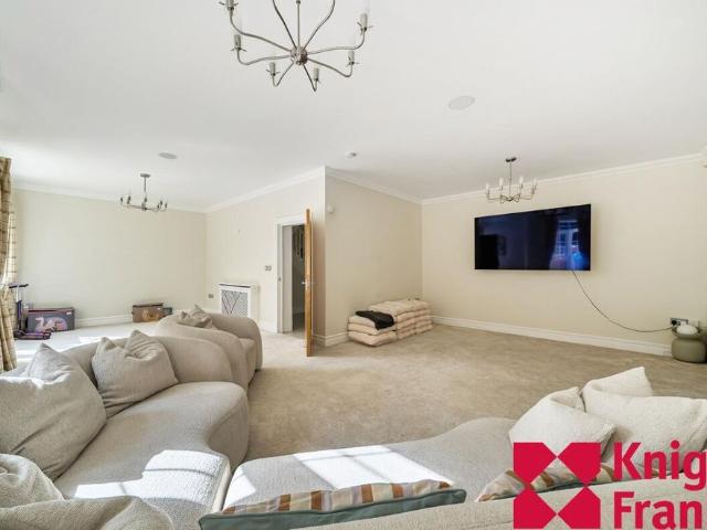 This spacious family home is set over four floors and is set behind gates