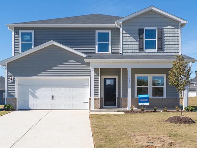 This 2600 square foot plan comes packed with exceptional features, like a first floor bedroom and bath perfect for overnight guests, and an open concept living space perfect for hosting gatherings.