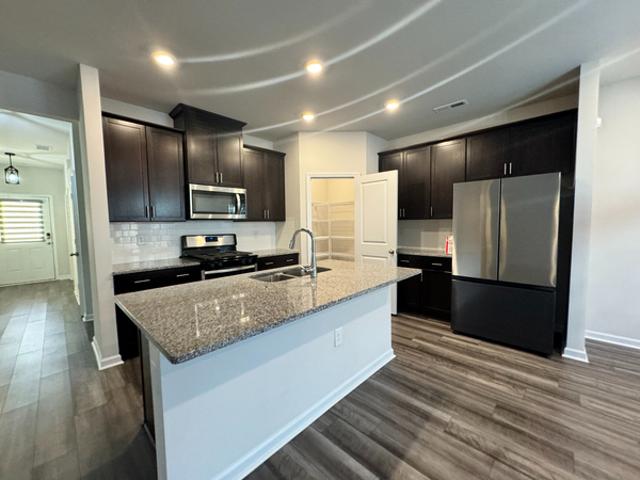 This 4 year old energy efficient house is located in a small community called Bowman Village, with easy access to I 40 and I 85. It is located near the community entrance and is on a corner lot.