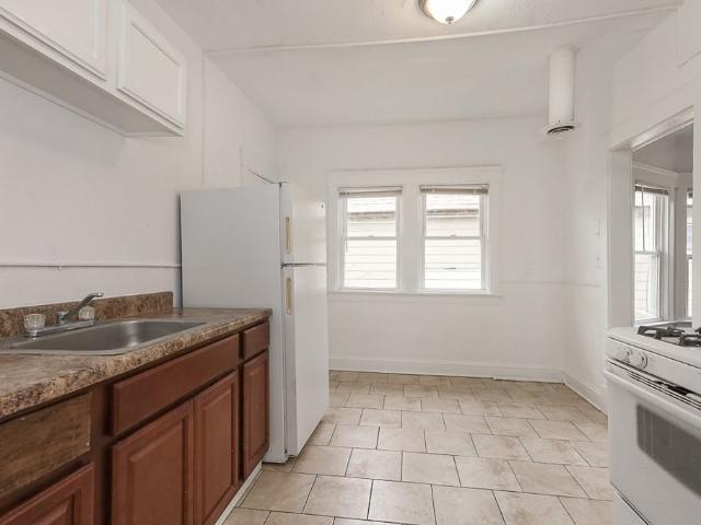 Three Family Home 2 Bedroom Apartment for Rent at 686 East 118th Street, Cleveland, OH 44108 Forest Hills