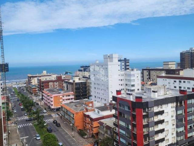 Três dormitórios mobiliado andar alto no centro de Capão da Canoa RS