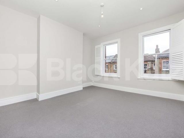 Triplex & offering 1160 Sq. Ft. of living & entertaining space