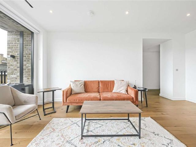 Two bedroom apartment with a balcony looking over the residents' private courtyard