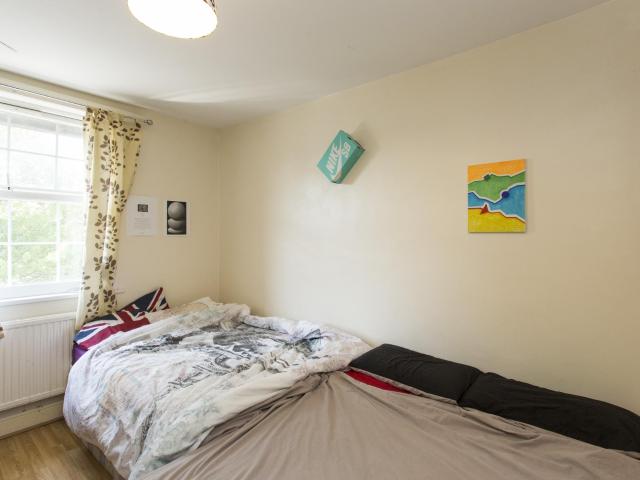 Twin bedroom with a cool window view, in Acton Has a Room