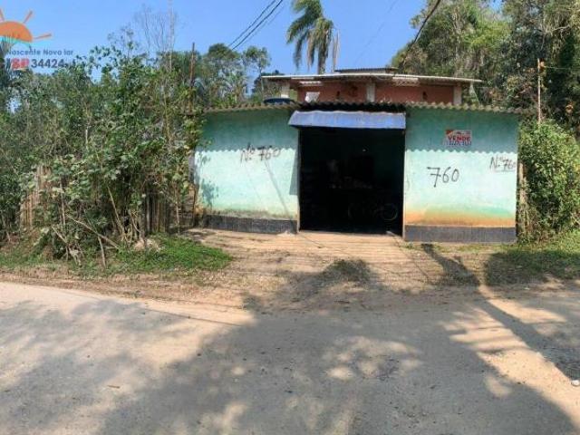 Vende se um terreno com duas casas