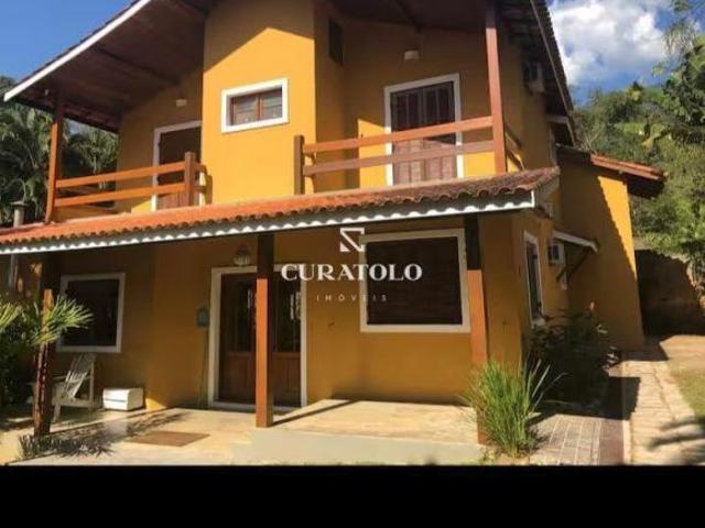 Viva o sonho de ter um lar de veraneio na praia da feiticeira, em Ilhabela Casa em condomínio com 2