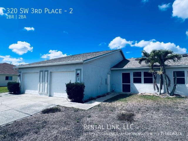 Waterfront living with wide lake views, a screened lanai, and direct access to enjoy the outdoors