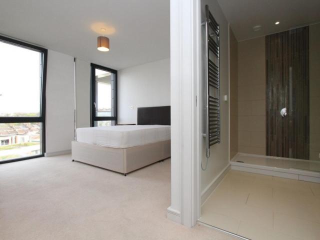 Welcoming bedroom with ensuite bathroom in a shared flat in Greenwich Has a Room