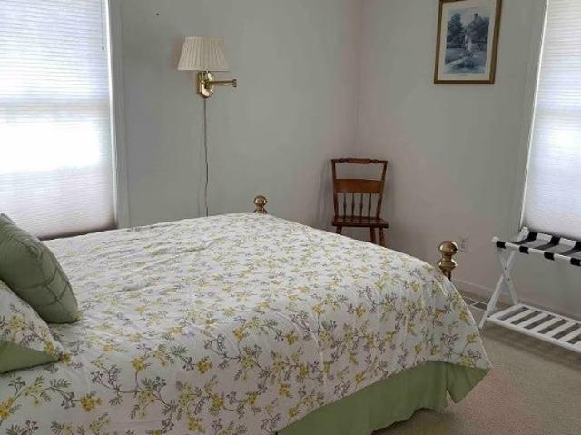 Well furnished master bedroom with a private bath