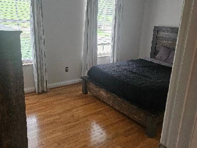 Well lit room with hardwood