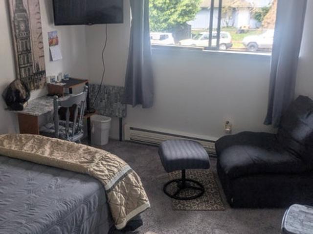WELL LIT ROOM WITH LARGE SHELVED WALK IN CLOSET