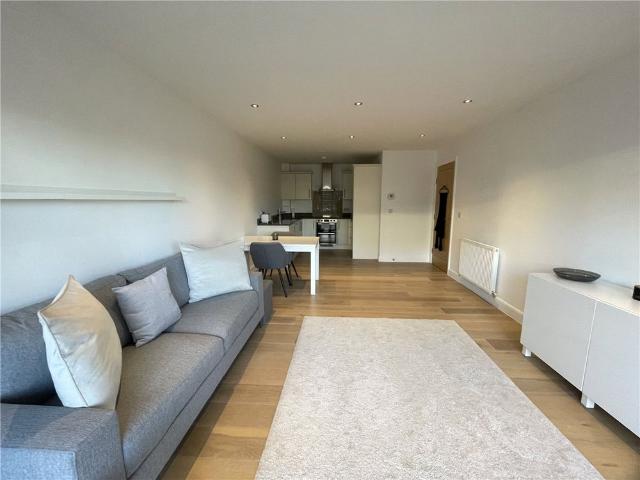 Well presented second floor apartment with private balcony and allocated parking in the sought after Racecourse development