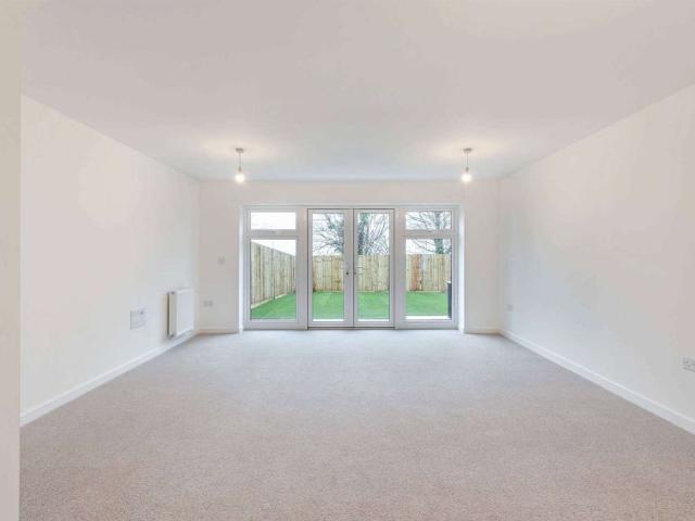 A modern three bedroom family home with private garden and parking