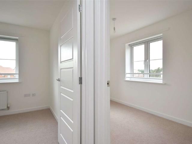 A modern three bedroom family home with private garden and parking