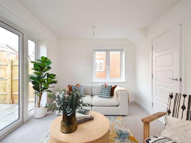 A modern three bedroom family home with private garden and parking