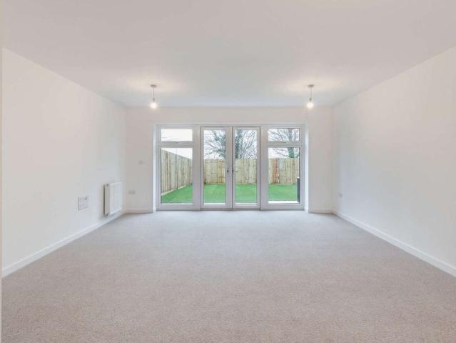 A modern three bedroom family home with private garden and parking
