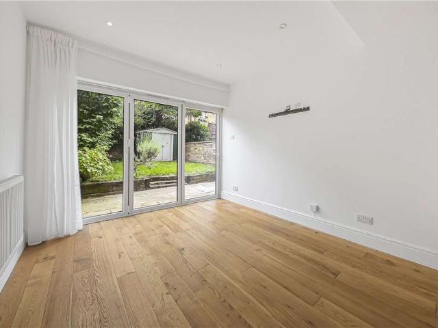 A modern two bedroom garden apartment with its own entrance and private patio garden