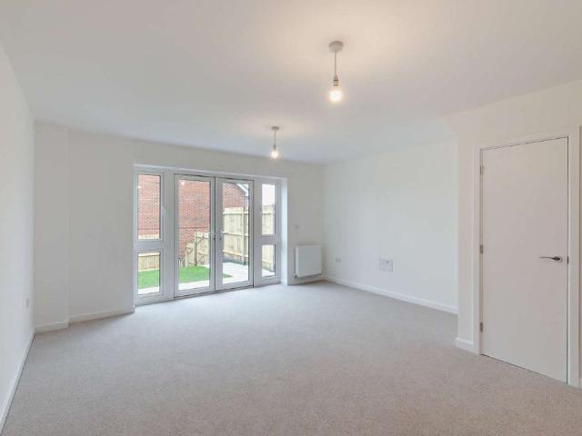 A modern four bedroom family home with private garden and parking