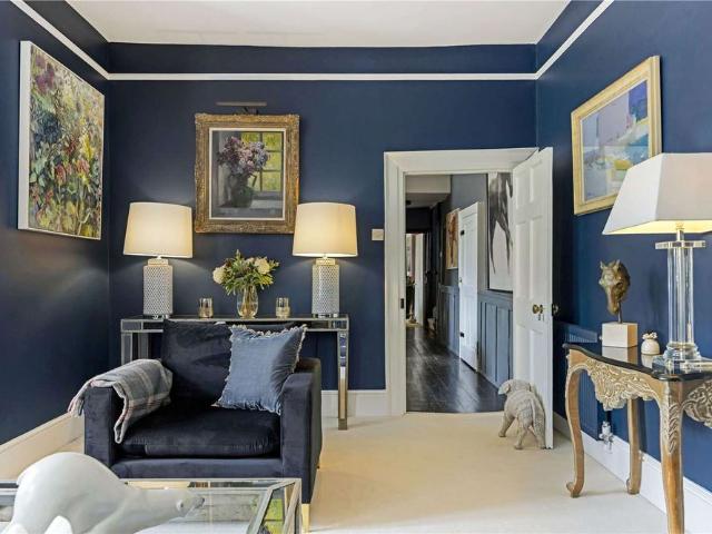 A most attractive Grade II Listed village house with exceptional interiors and beautifully landscaped gardens and grounds