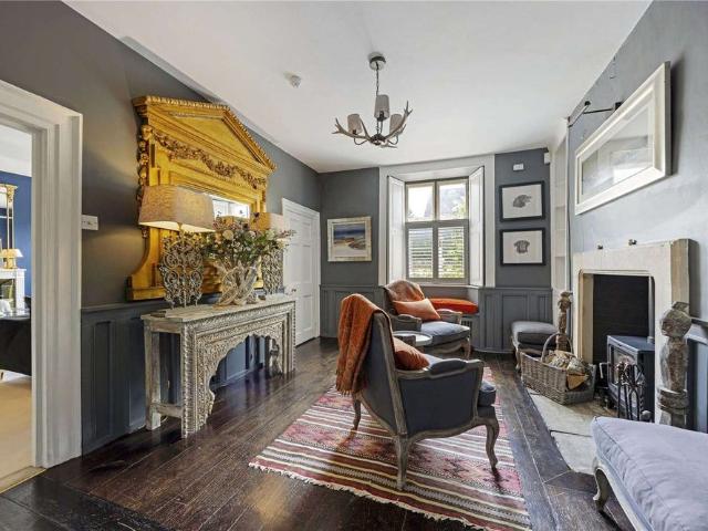 A most attractive Grade II Listed village house with exceptional interiors and beautifully landscaped gardens and grounds