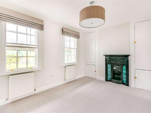 A beautifully presented 2 bedroom house with a patio garden, situated on a popular residential square