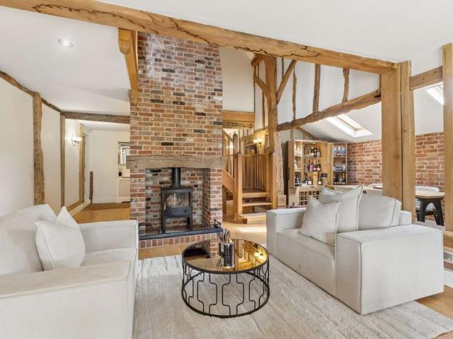 A beautifully presented three bedroom coach house boasting character throughout