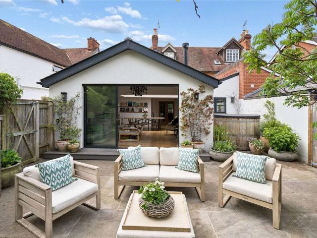 A beautifully presented and thoughtfully extended village home, offering a particularly impressive open plan living space, set within a mature and private garden