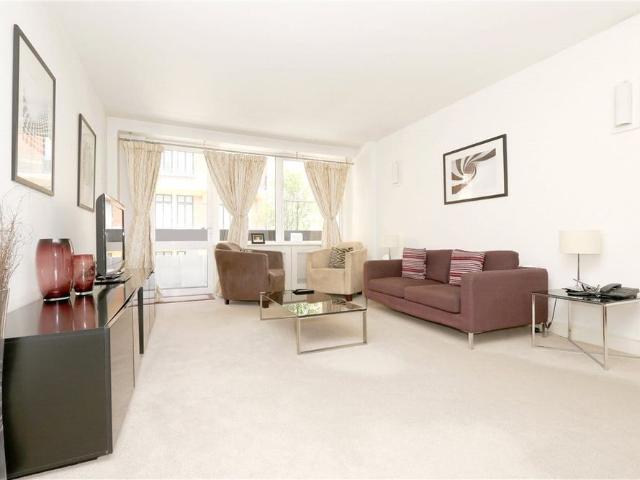 A beautifully presented apartment spanning over 800 sq ft, set within an impressive portered building and offering generous, light filled contemporary living finished to a high standard
