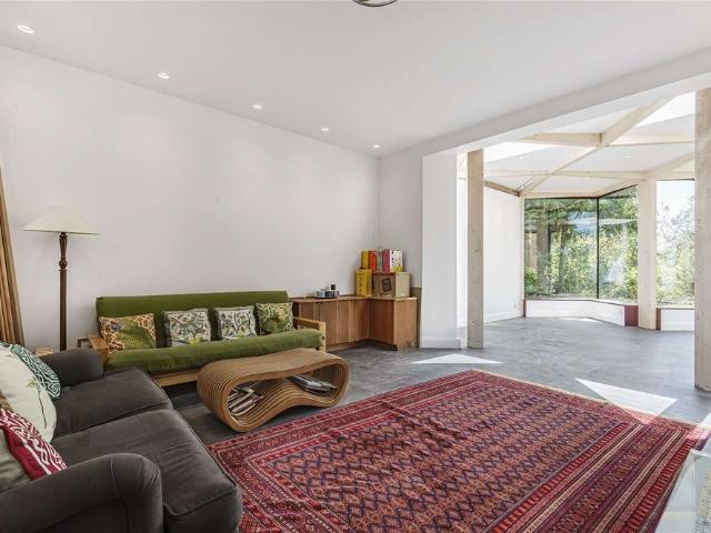 A beautifully presented family home set back benefitting from a driveway and large split level garden