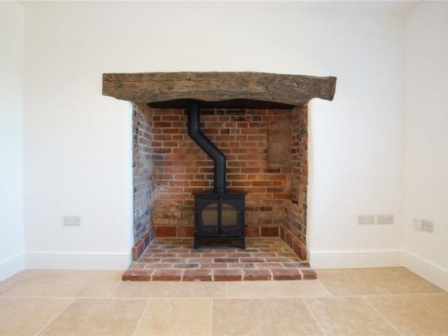 A beautifully refurbished brick and flint cottage combining charming period character with stylish, high quality finishes throughout