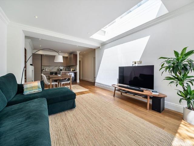 A beautifully refurbished garden apartment set on a picturesque tree lined street in the heart of St John's Wood
