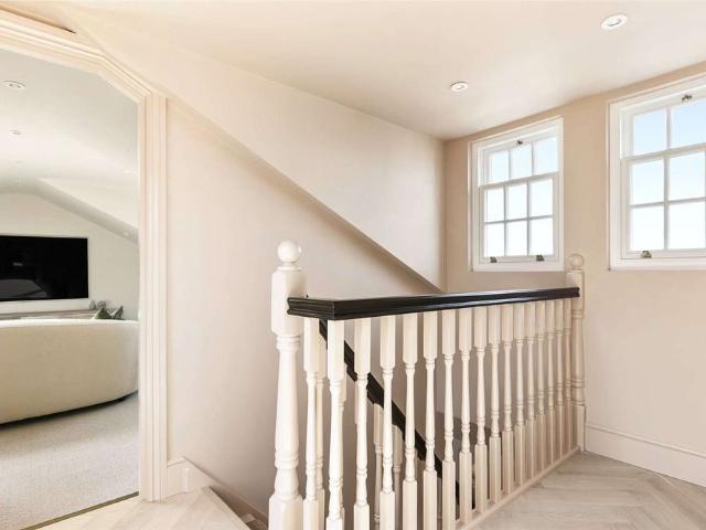 A beautifully refurbished three bedroom apartment with direct lift access, arranged over the top floors of an elegant Victorian conversion