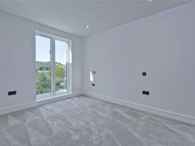 A brand new, one bedroom second floor apartment with balcony and allocated basement parking