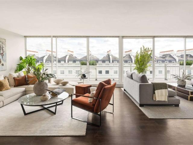 A bright four bedroom penthouse apartment with spectacular reception room, floor to ceiling windows and a southerly terrace which spans the width of the building
