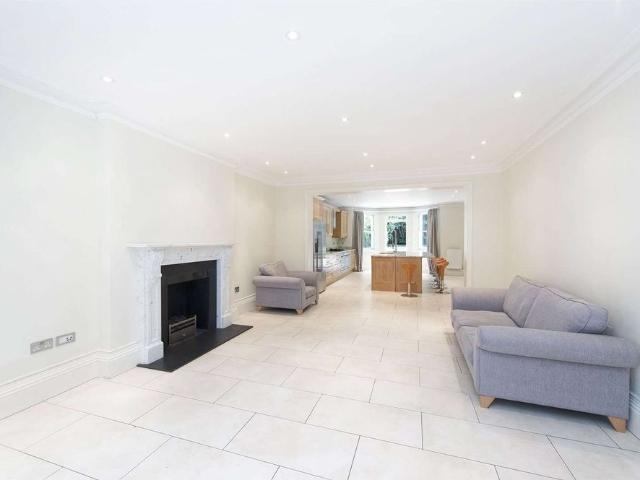 A charming and very spacious 6 bedroom unfurnished family house arranged over five floors boasting a large private garden and located in the Royal Borough of Kensington & Chelsea